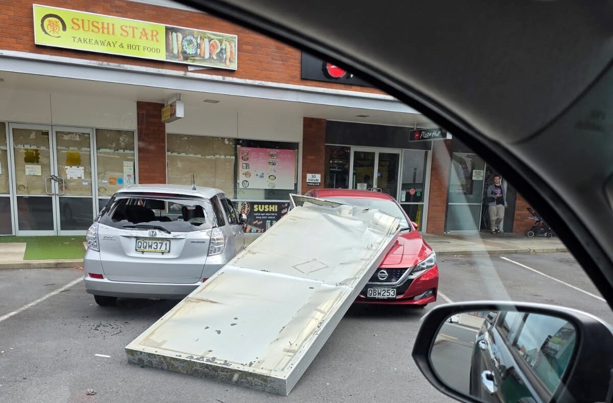 Falling supermarket sign lands on parked vehicles - Times